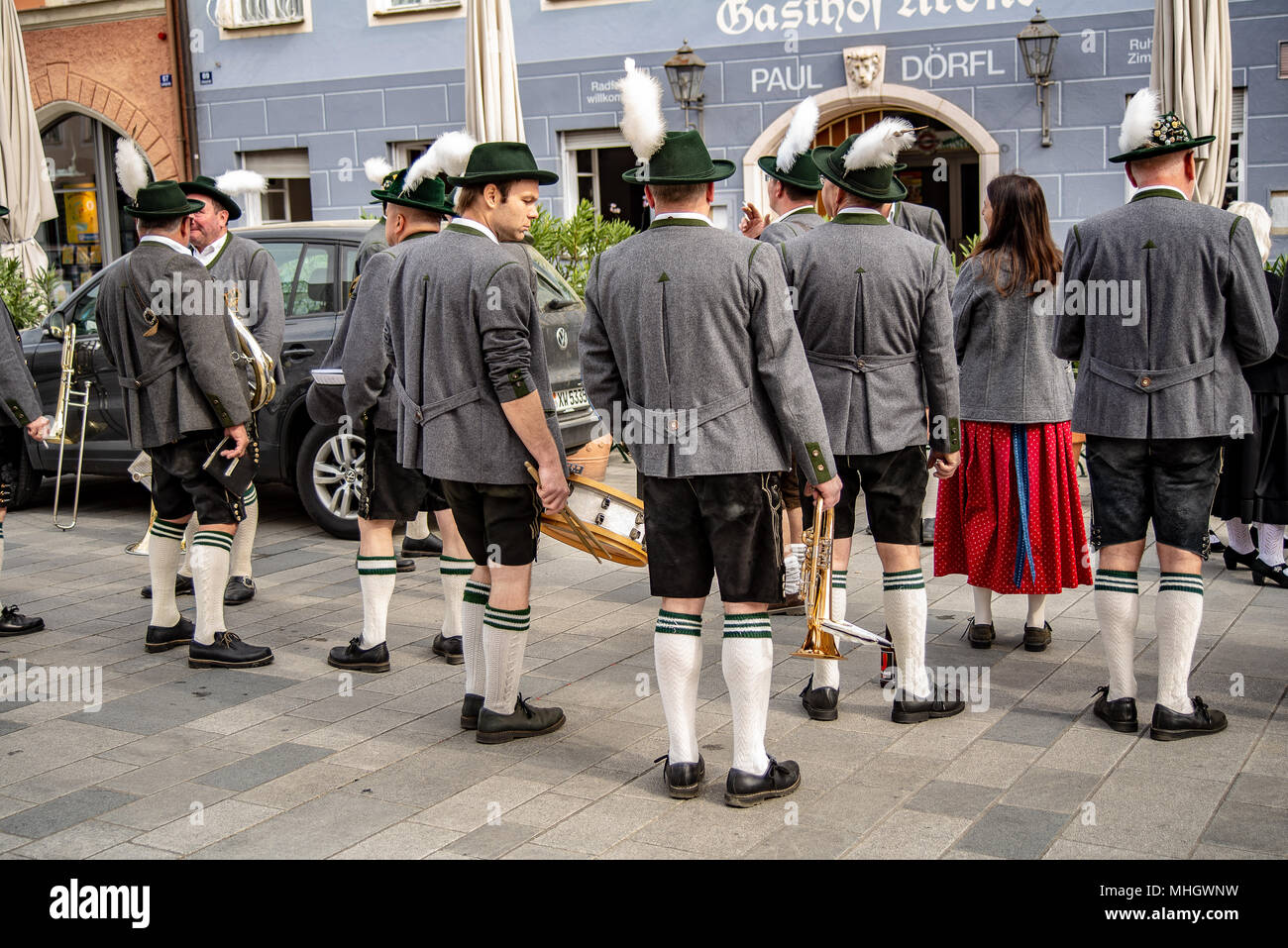 The band stops briefly in front of a local pub on their way to the ...