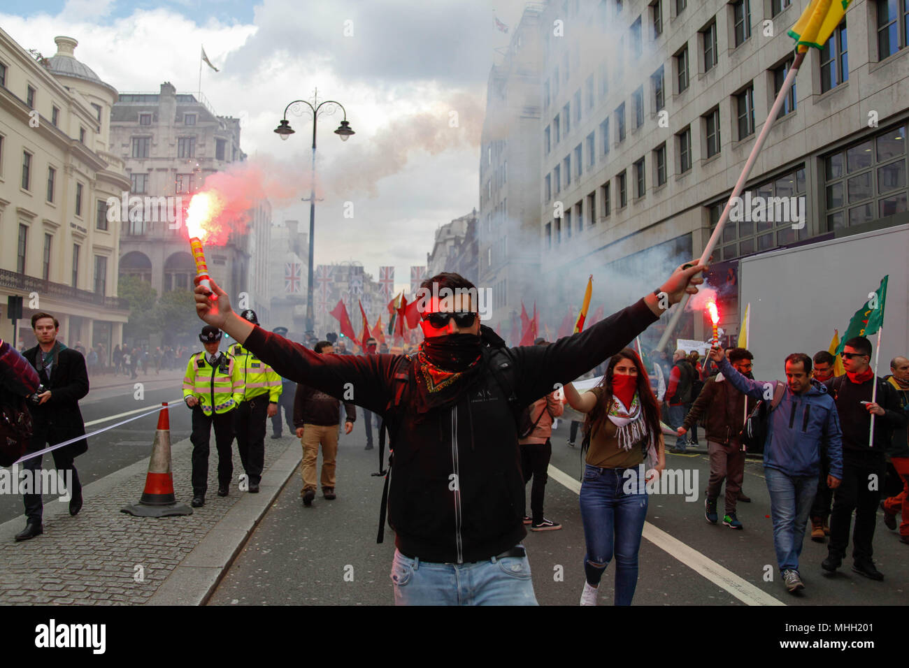 London, UK. 1st May 2018. Kurdish protesters set off Flares at Mayday ...