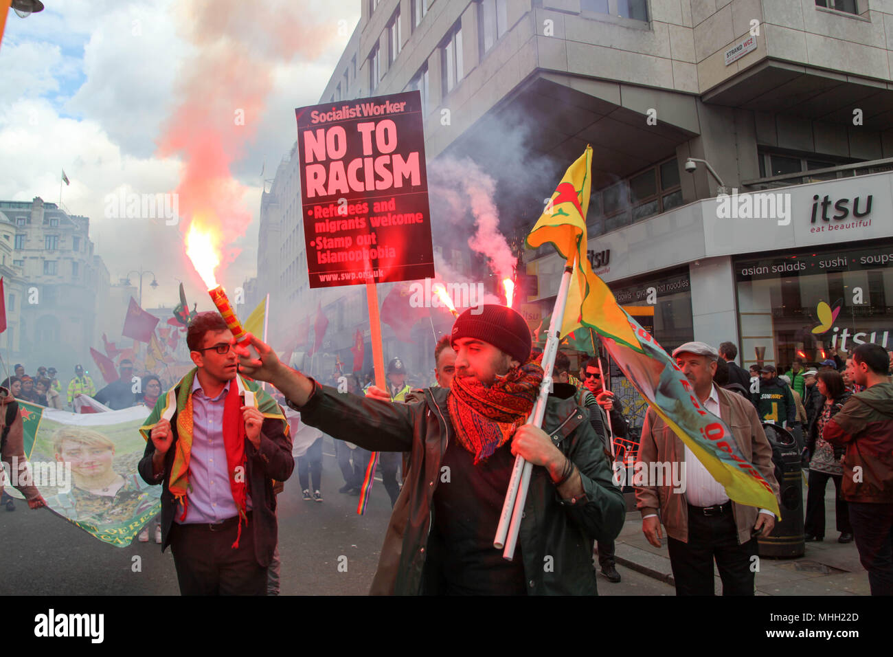 London, UK. 1st May 2018. Kurdish protesters set off Flares at Mayday ...