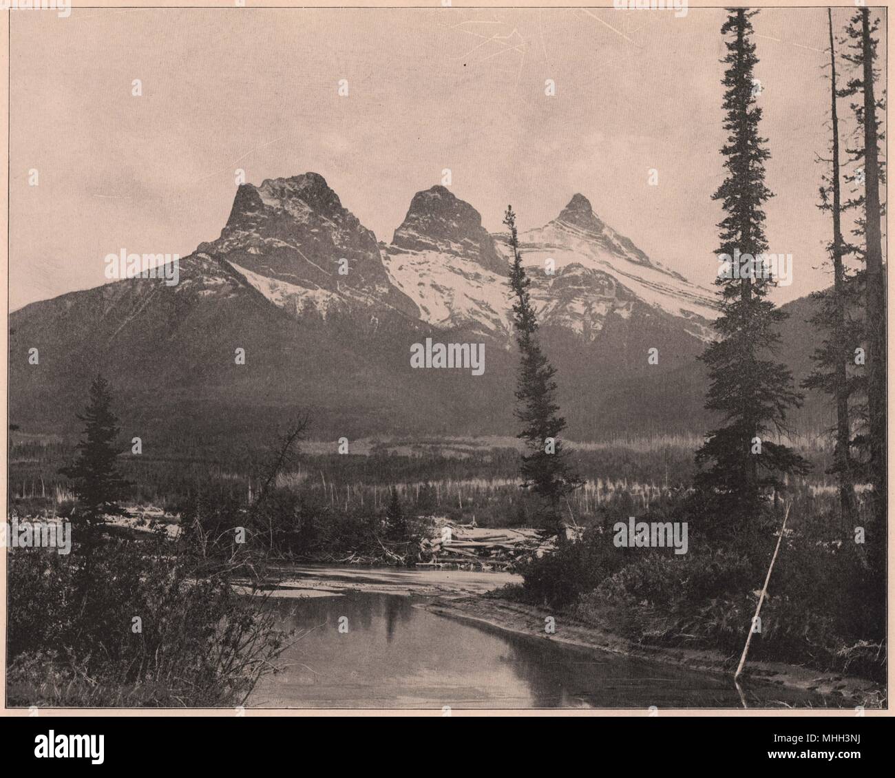 The three Sisters, Canmore, Canadian Pacific Railroad Stock Photo - Alamy