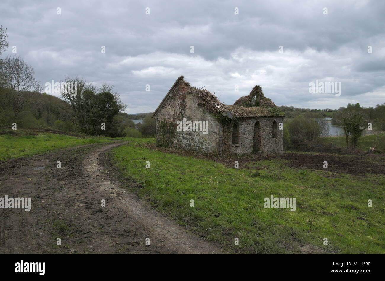 Ruined cottage overlooking a lake Stock Photo - Alamy