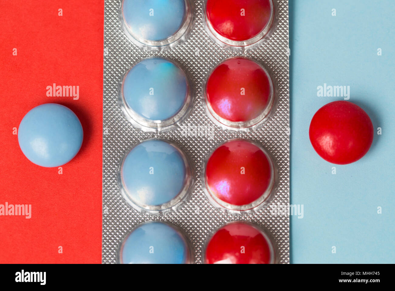 packing of tablets on a colorful background next to two unpacked ...