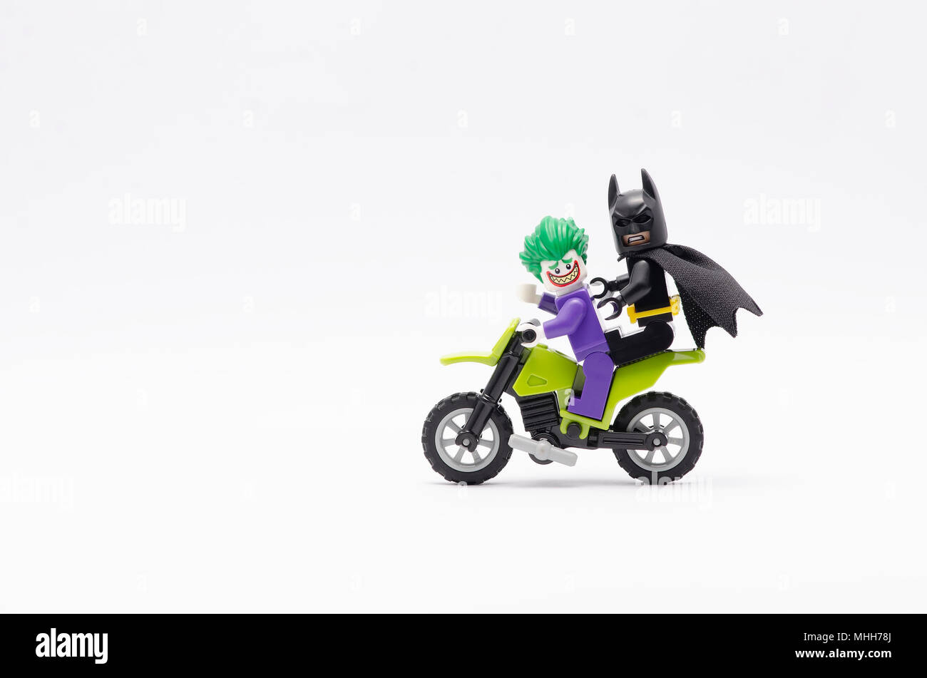 mini figure of joker with batman on her back riding dirt bike. Lego ...
