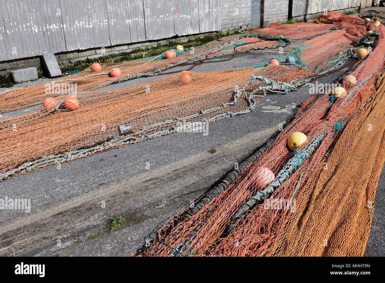 fishing net laid out on a pier Stock Photo - Alamy