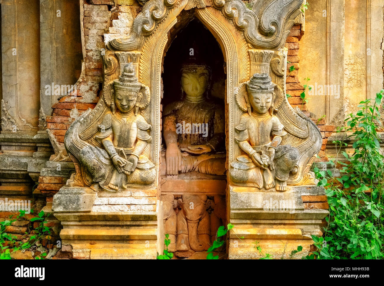 Detail of old stone temple ruins with statues, Myanmar (Burma Stock ...
