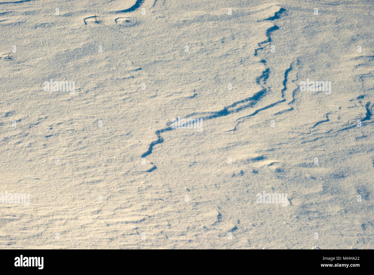 pure white snow background with windy waves pattern Stock Photo - Alamy
