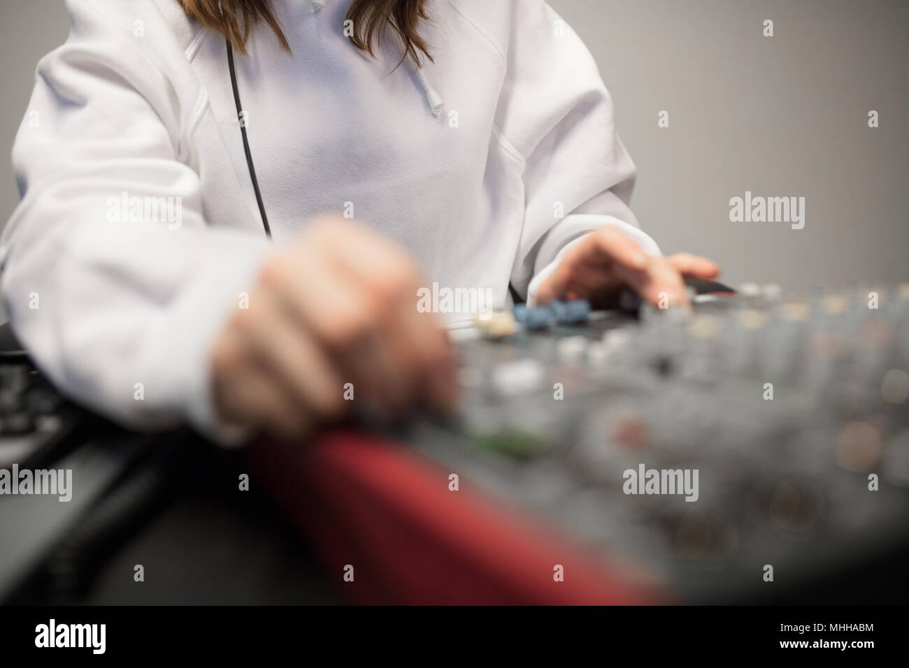 Midsection Of Radio Host Using Music Mixer In Studio Stock Photo - Alamy