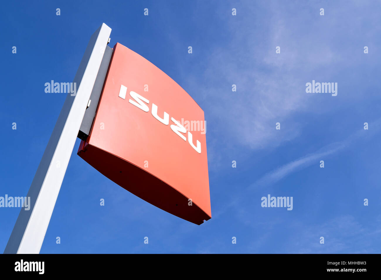 Isuzu dealership sign against blue sky. Isuzu is a Japanese commercial ...