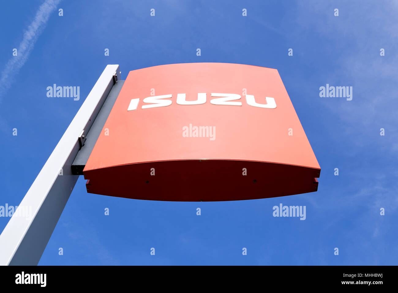 Isuzu dealership sign against blue sky. Isuzu is a Japanese commercial ...