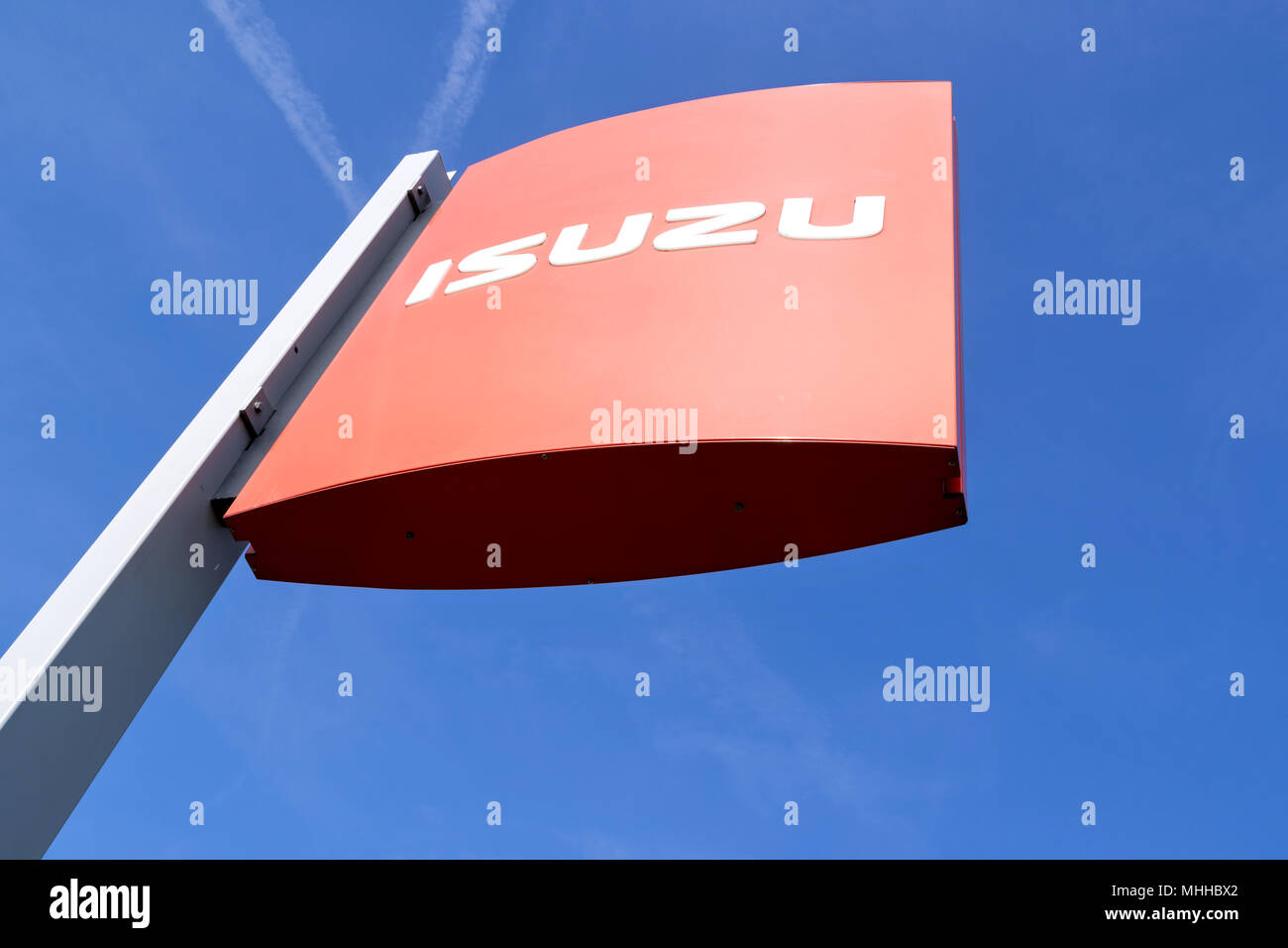 Isuzu dealership sign against blue sky. Isuzu is a Japanese commercial ...