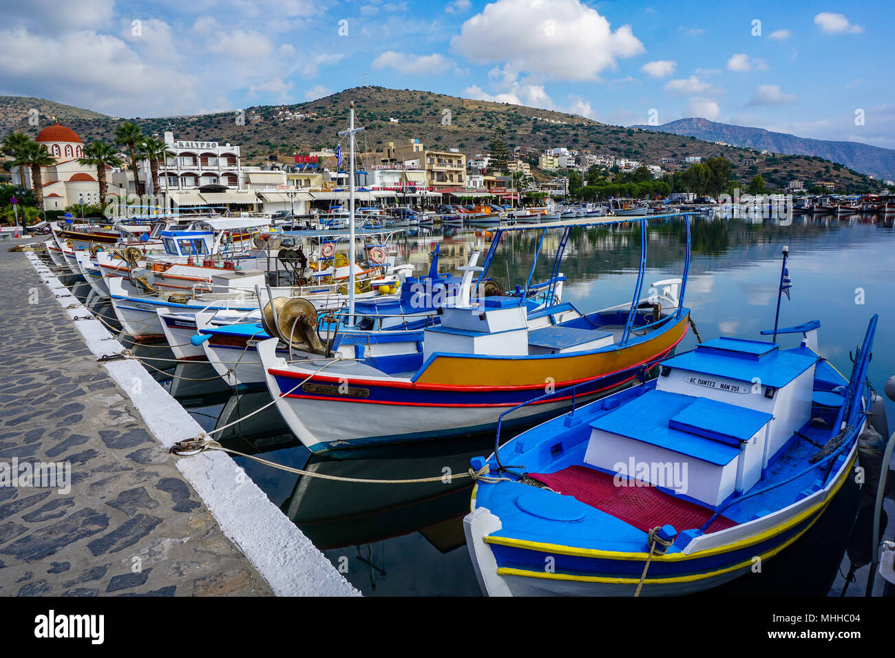 Traditional fishing boats with Elounda, Crete, Greece in background ...