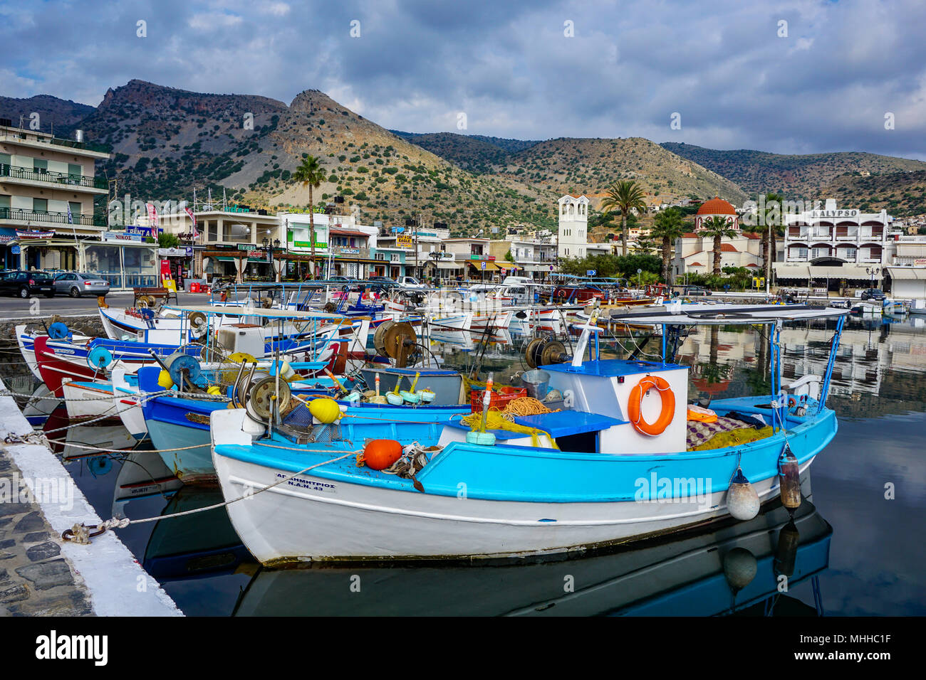 Traditional fishing boats with Elounda, Crete, Greece in background ...