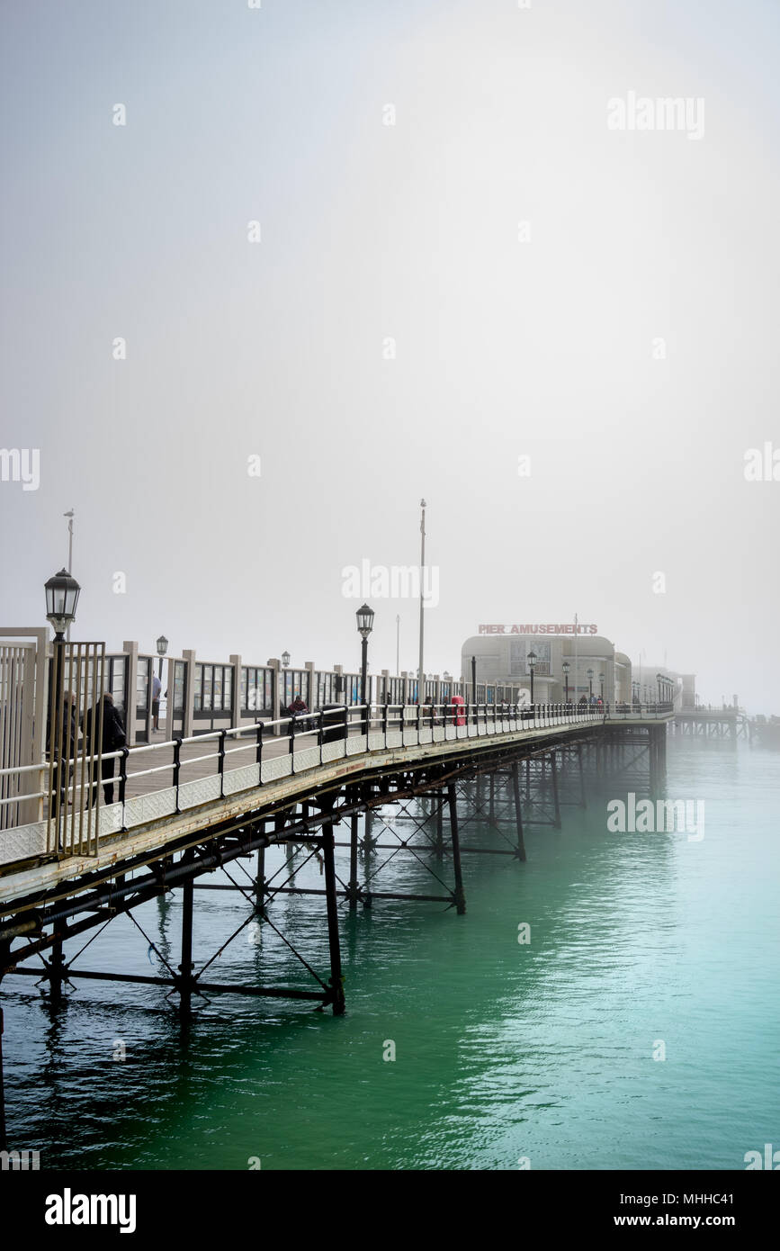 The Victorian pier in Worthing West Sussex, England on a misty day in ...