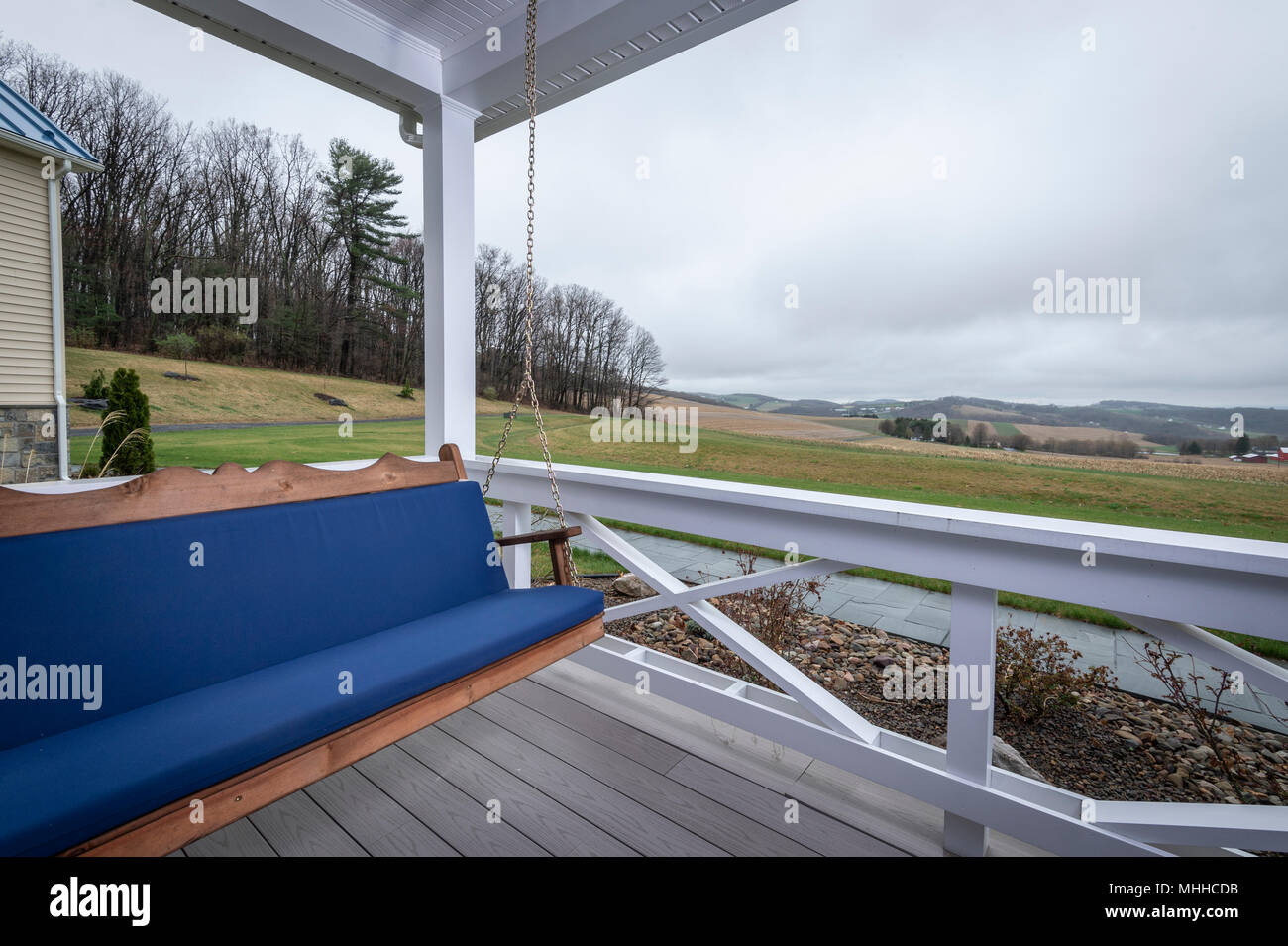 Porch Swing Overlooking Fields Of Farm Stock Photo - Alamy