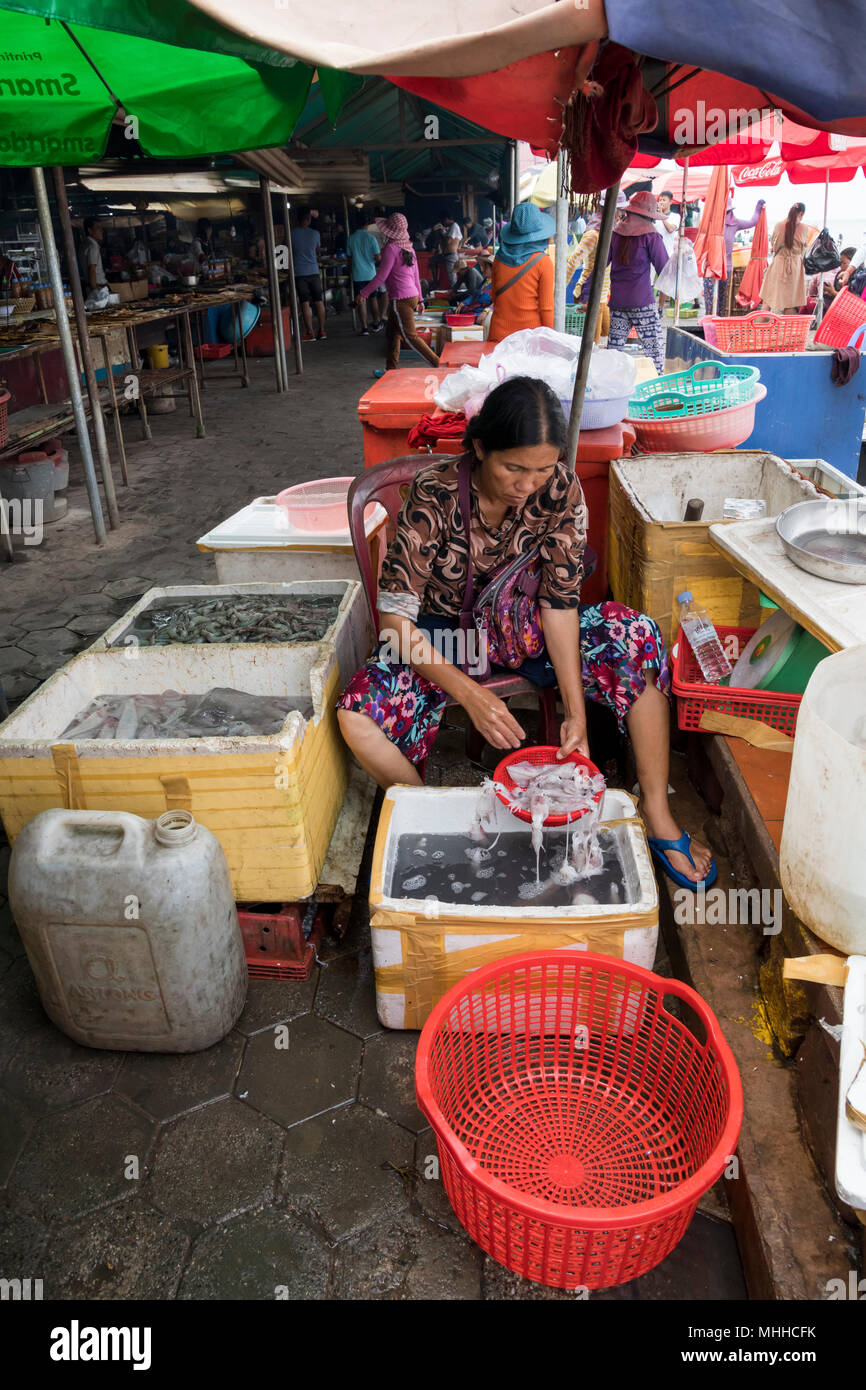 Woman fishmonger sorting Octopus at the famous Crab Market of Krong ...