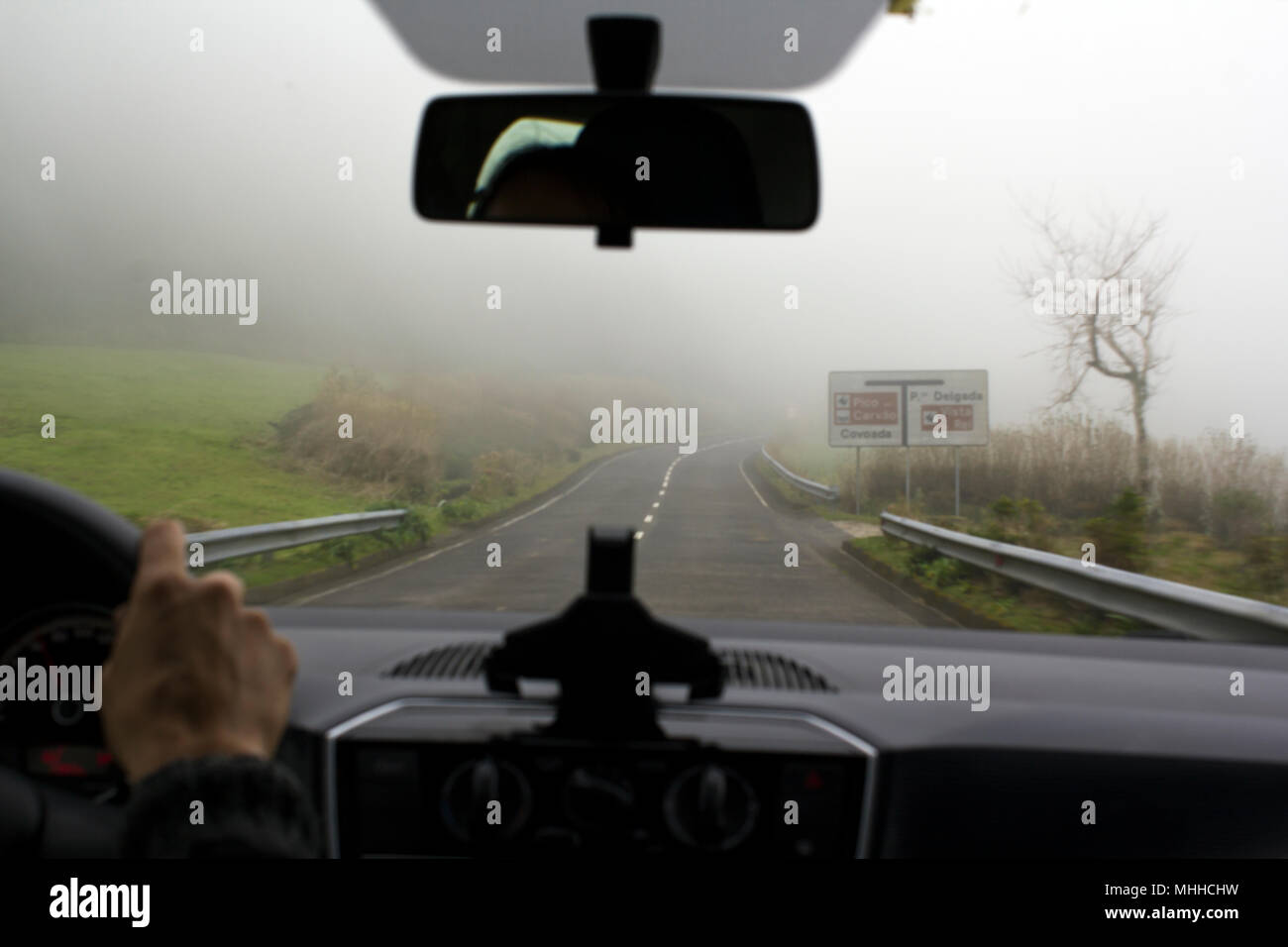 Driving on a foggy road. Inside car view Stock Photo - Alamy