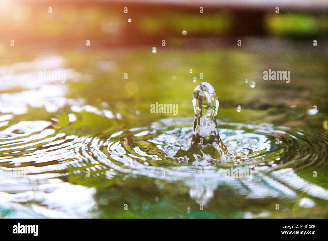 water drops and splash on the pool surface Stock Photo - Alamy