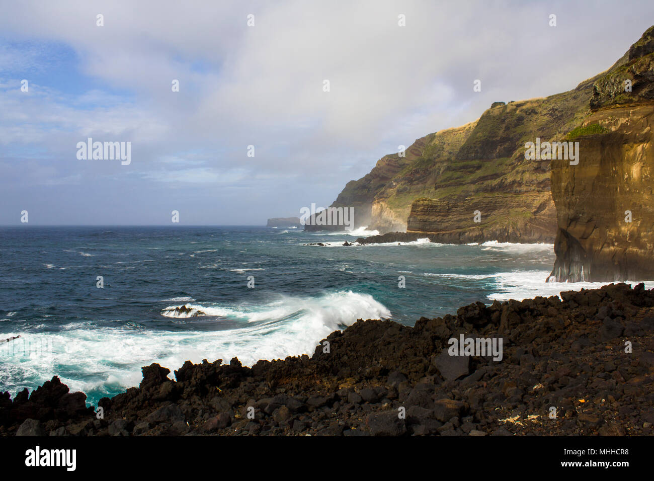 View of cliffs and seashore in volcanic area Stock Photo - Alamy