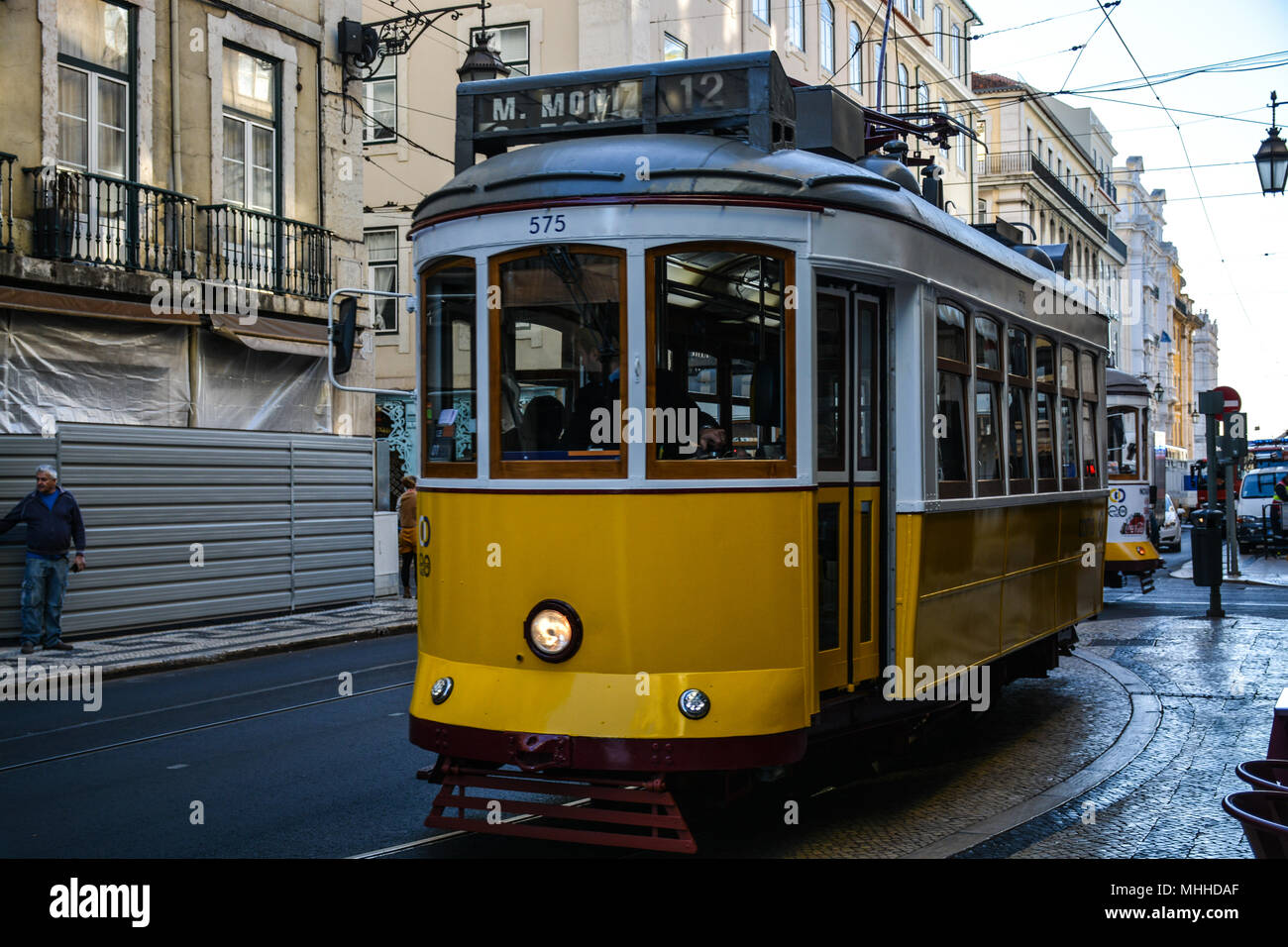 Yellow tram on the street of Lisbon, Portugal Stock Photo - Alamy