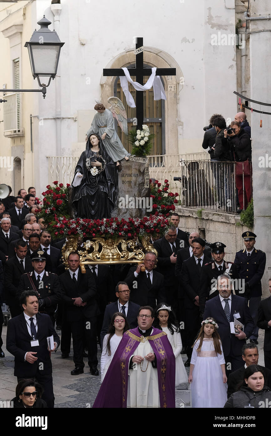 Penitent women dressed in black walk and sing religious songs during ...