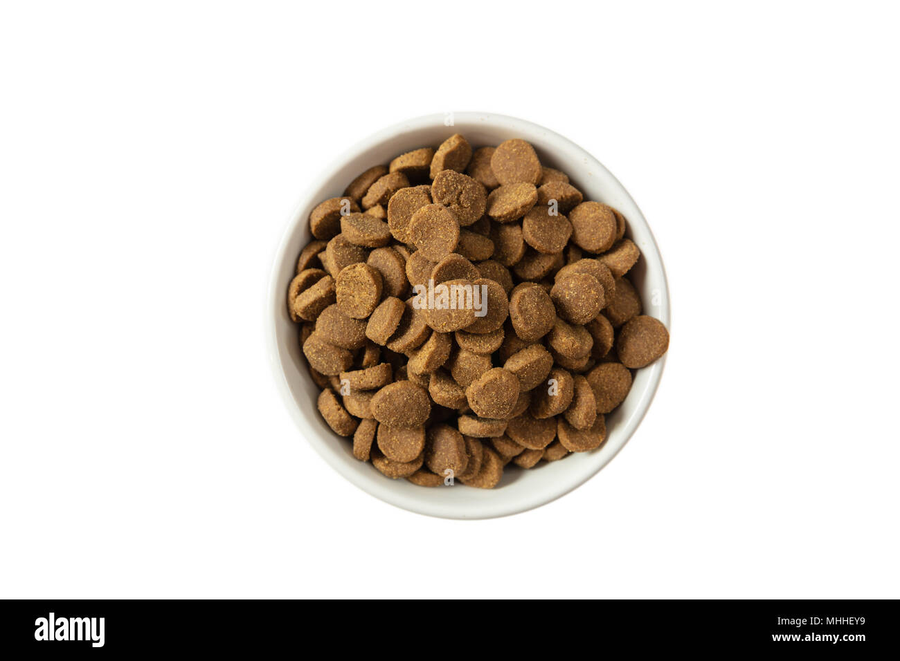 Pets dry food. Dogs kibble food in a white bowl isolated on white ...