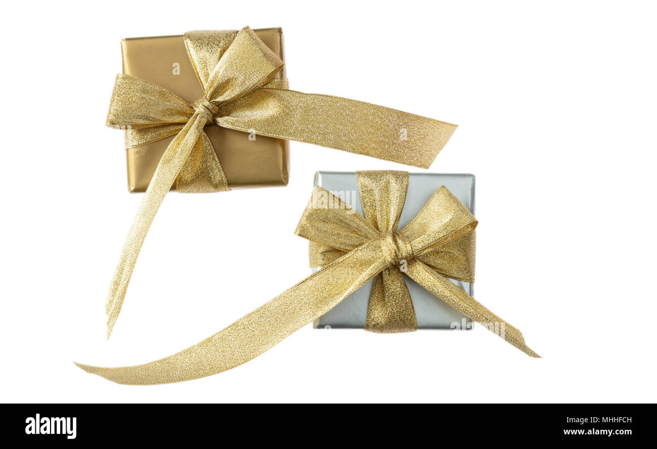 Silver and golden gift boxes with golden ribbons isolated on white ...