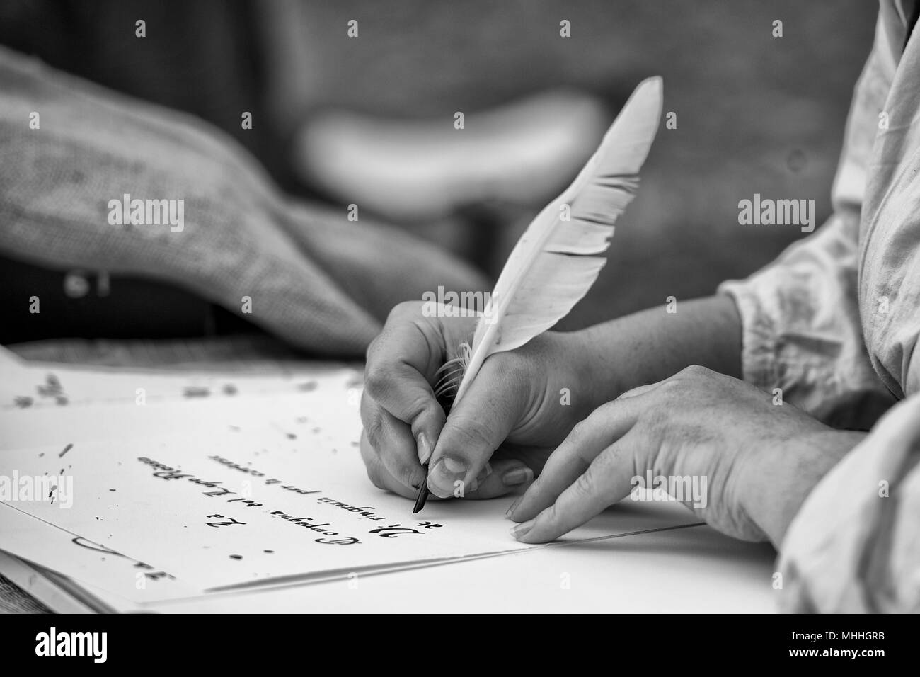 hands while writing a letter with a plume in black and white Stock ...