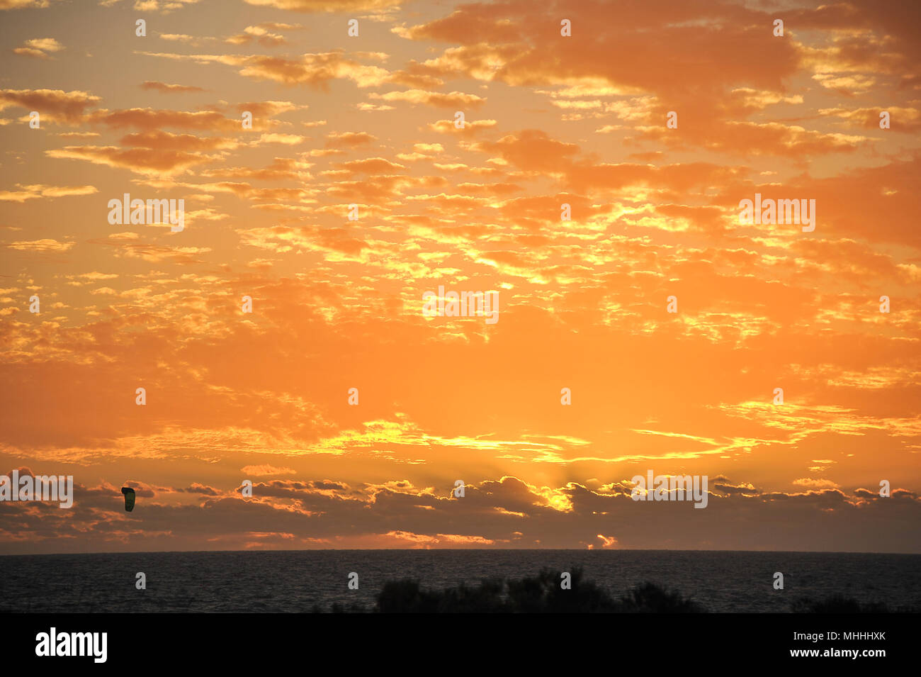 Fiery orange sunset off Trigg Beach, Western Australia. Dramatic sky ...