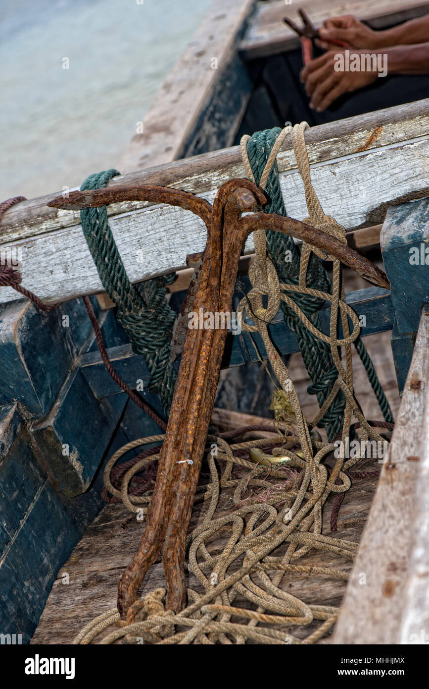 Old rugged anchor on fisherman boat Stock Photo - Alamy