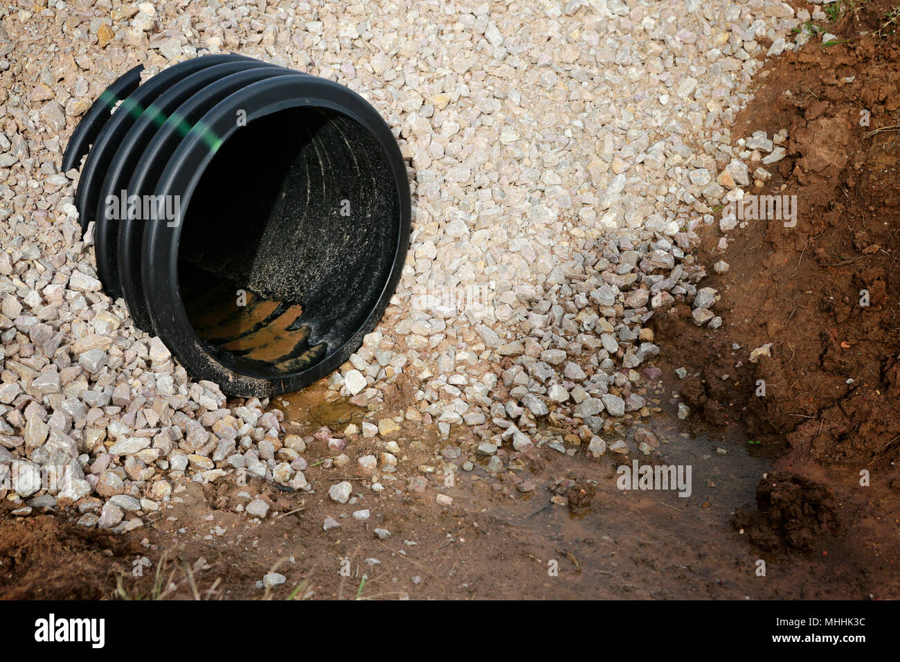 Drainage pipe: New culvert under small country side gravel road Stock ...