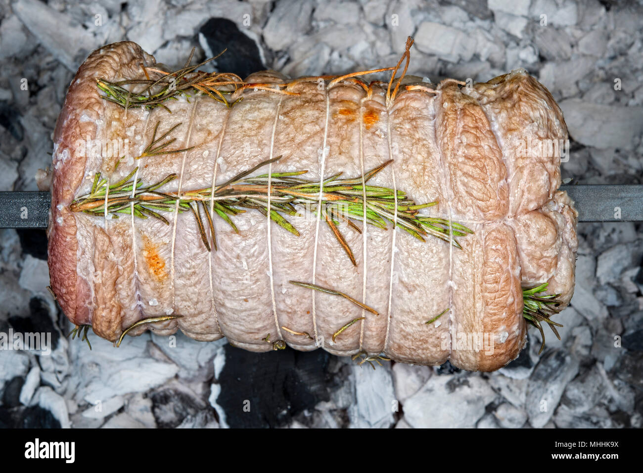 veal roast while cooking on charcoal barbecue Stock Photo - Alamy