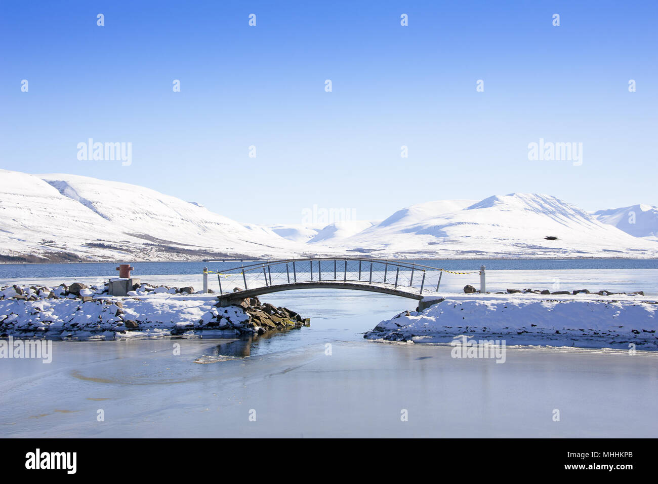 Pedestrian bridge in Akureyri with a view to Eyjafjordur, Iceland's ...