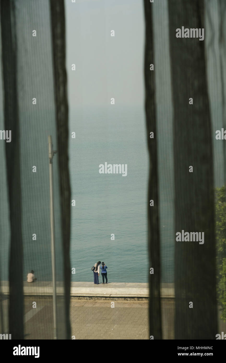 View through a window on to Marine Drive pathway overlooking the ...