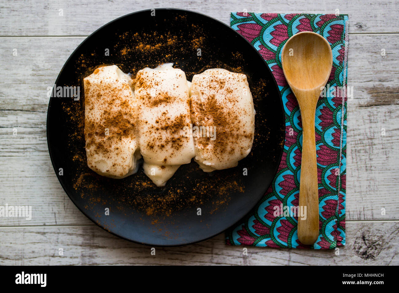 Turkish Dessert Tavuk Gogsu / Milk Baked Pudding in a black plate Stock ...