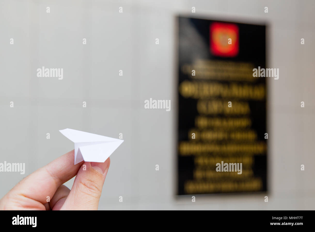 MOSCOW, RUSSIA - APRIL 30, 2018: A paper plane in hand on the ...