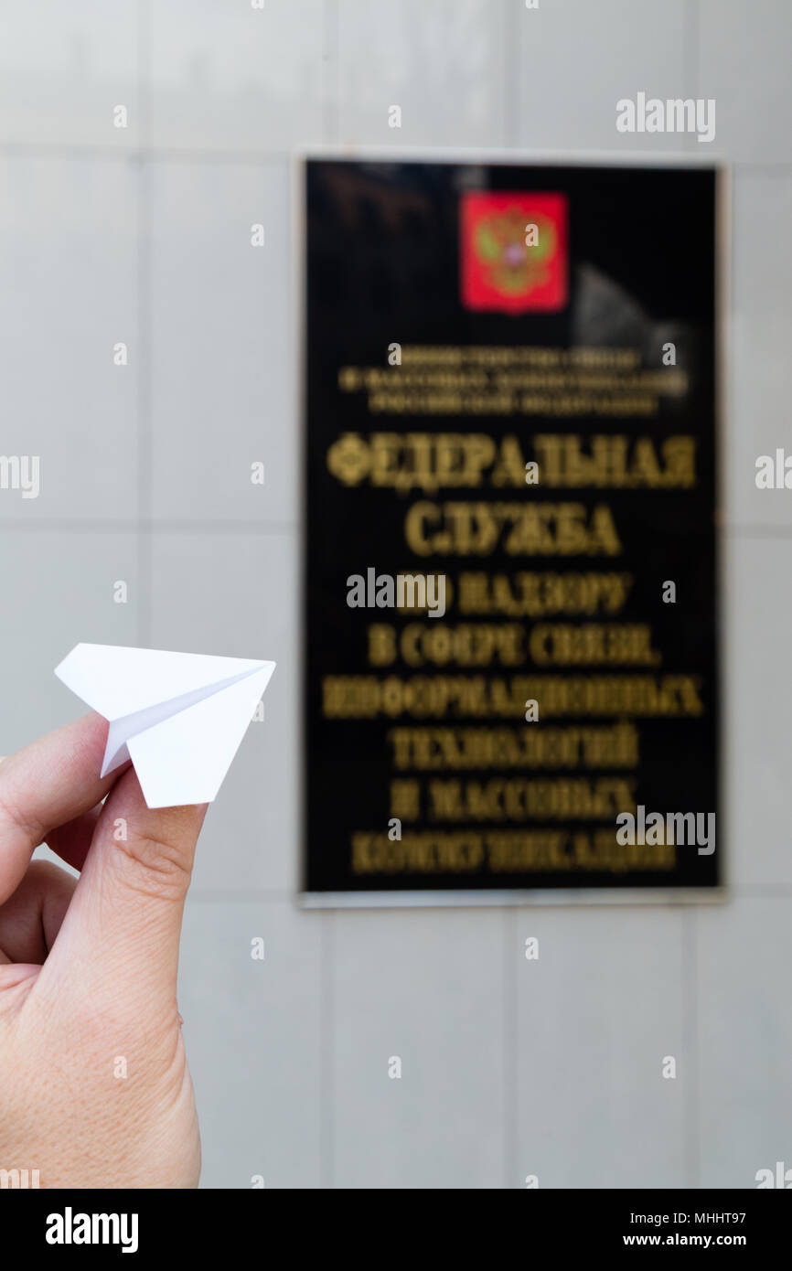 MOSCOW, RUSSIA - APRIL 30, 2018: A paper plane in hand on the ...