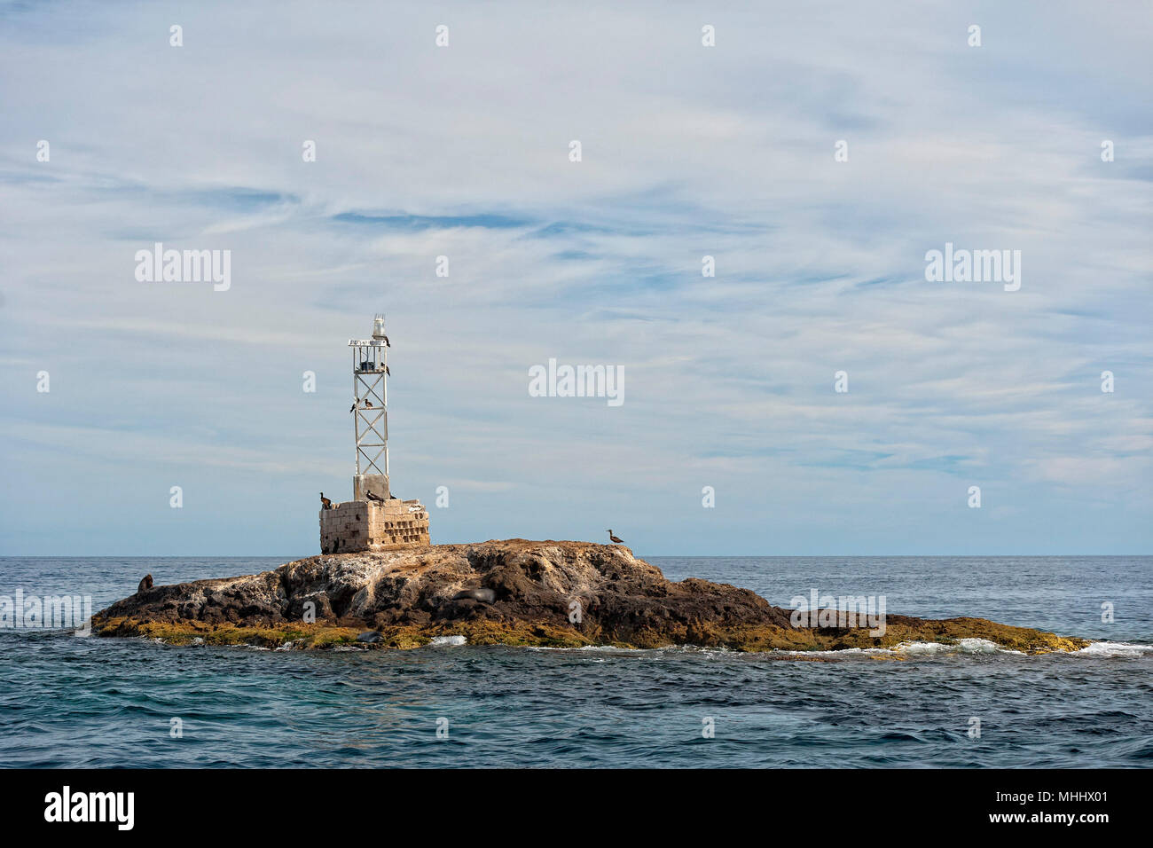 abandoned lighthouse on small rocks island Stock Photo - Alamy