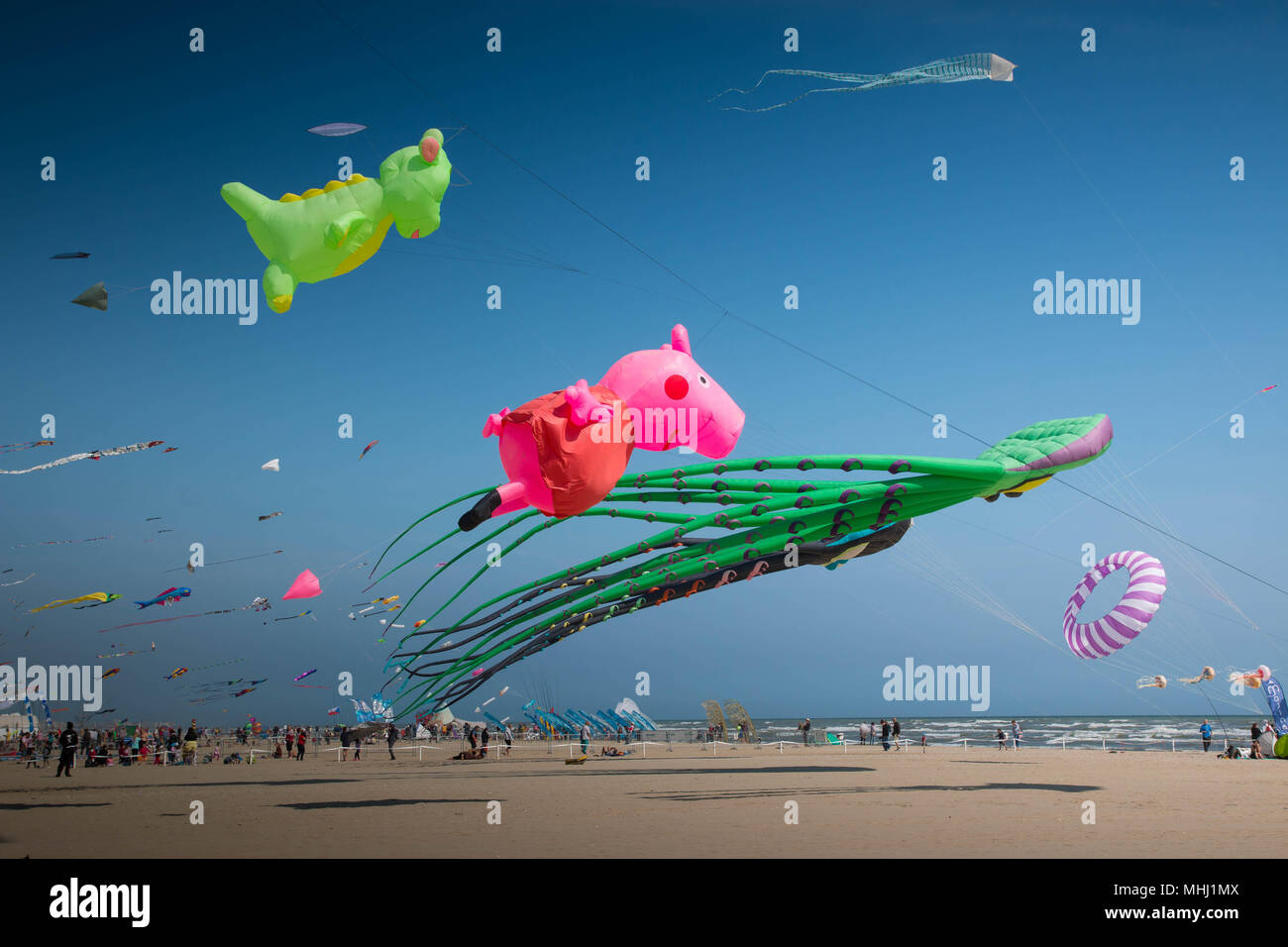 Many colorful kites in different shapes on the beach at Cervia ...