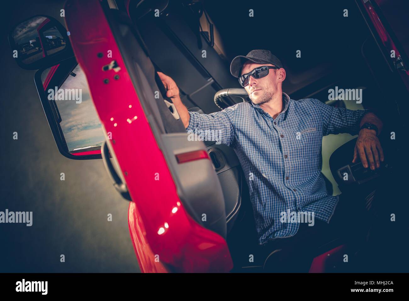 Young Truck Driver in His Brand New Semi Truck. Trucking Theme Stock ...