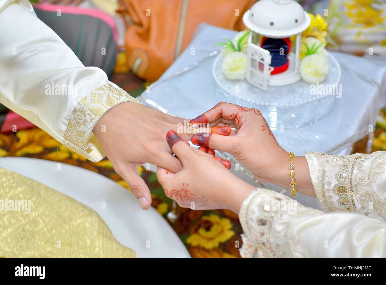 Placing the ring on her finger hi-res stock photography and images - Alamy