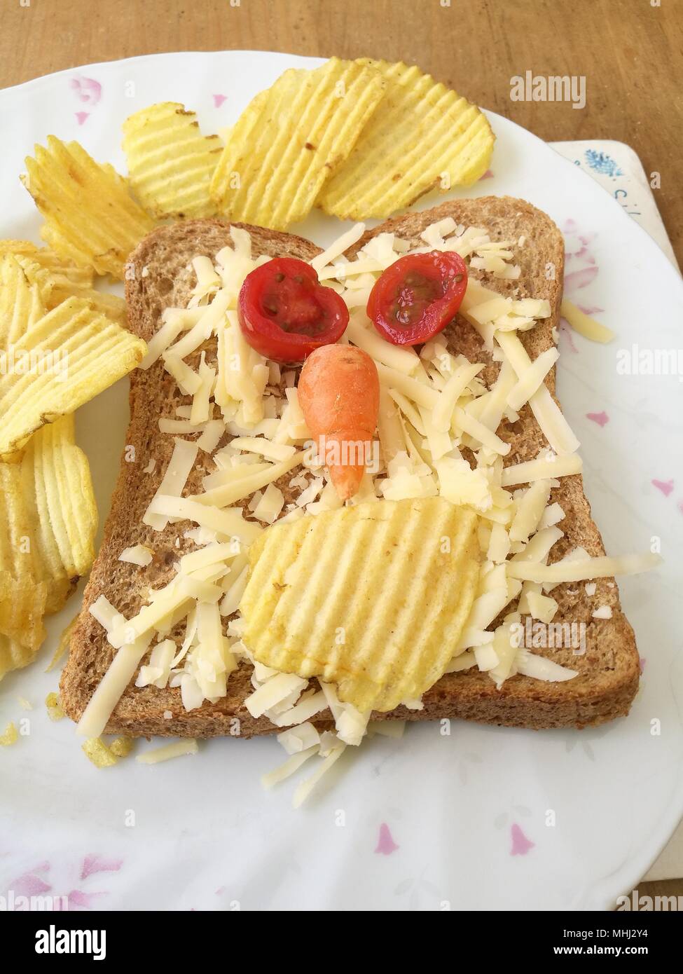 comical face made form food on bread Stock Photo - Alamy