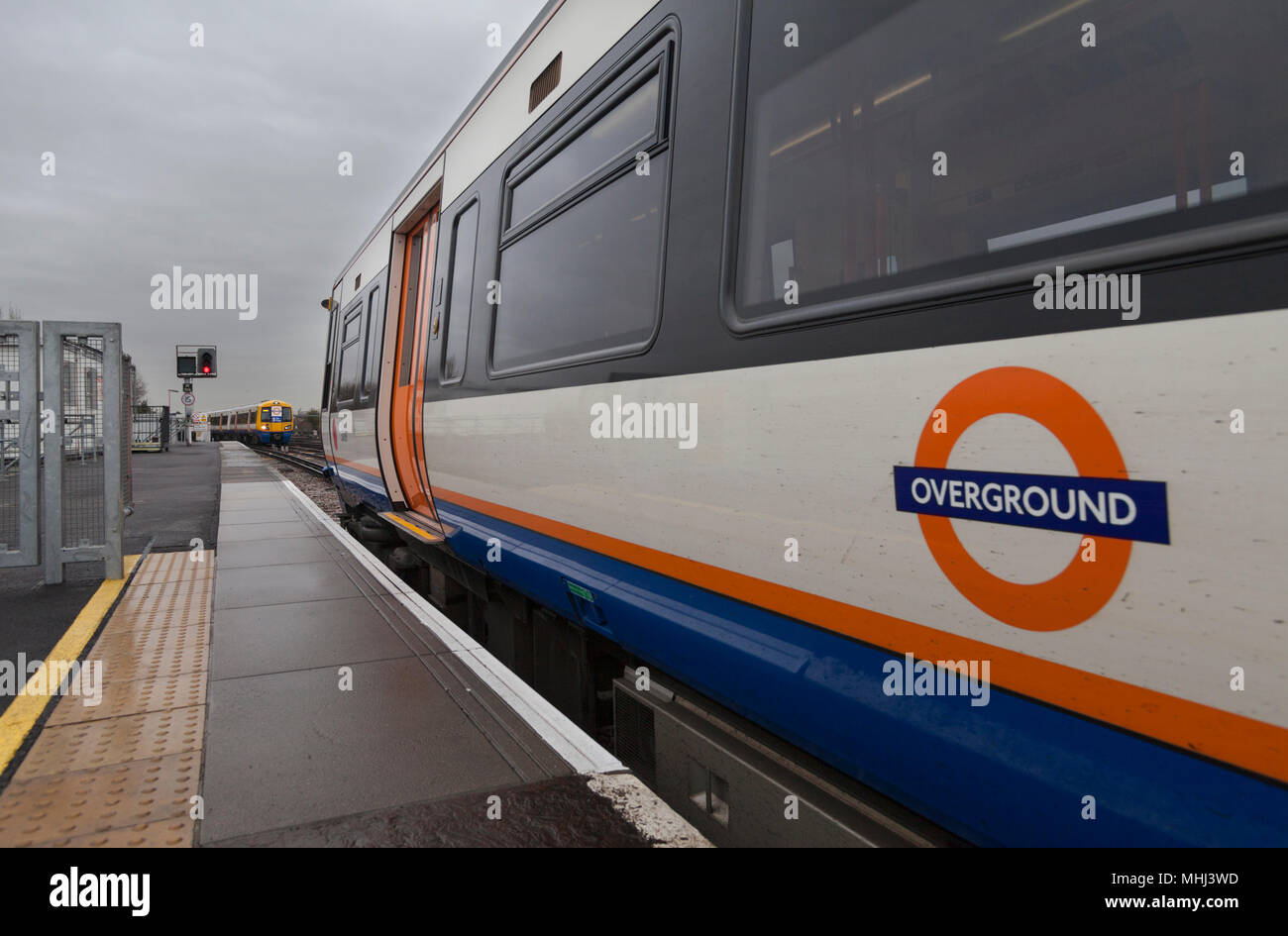 London Overground class 378 trains at Clapham Junction, south london showing the overground logo ...