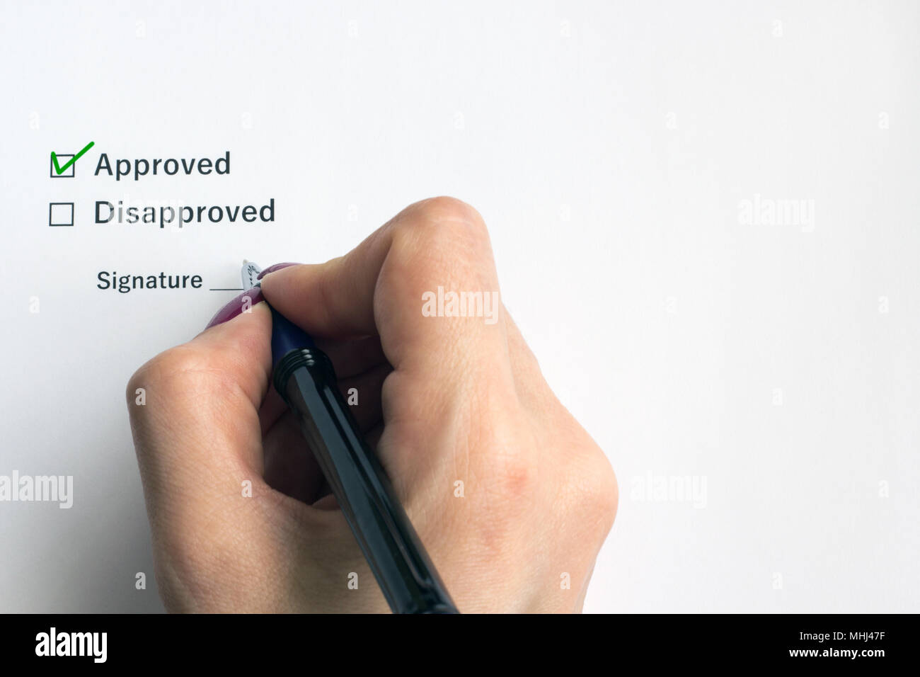 Female hand signs the document after the decision is made Stock Photo ...