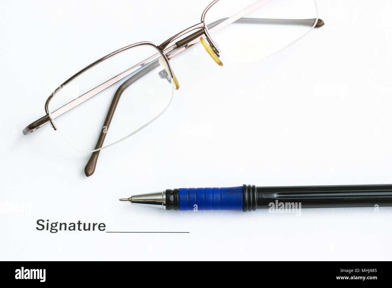 On the table is an important document, pen and glasses Stock Photo - Alamy