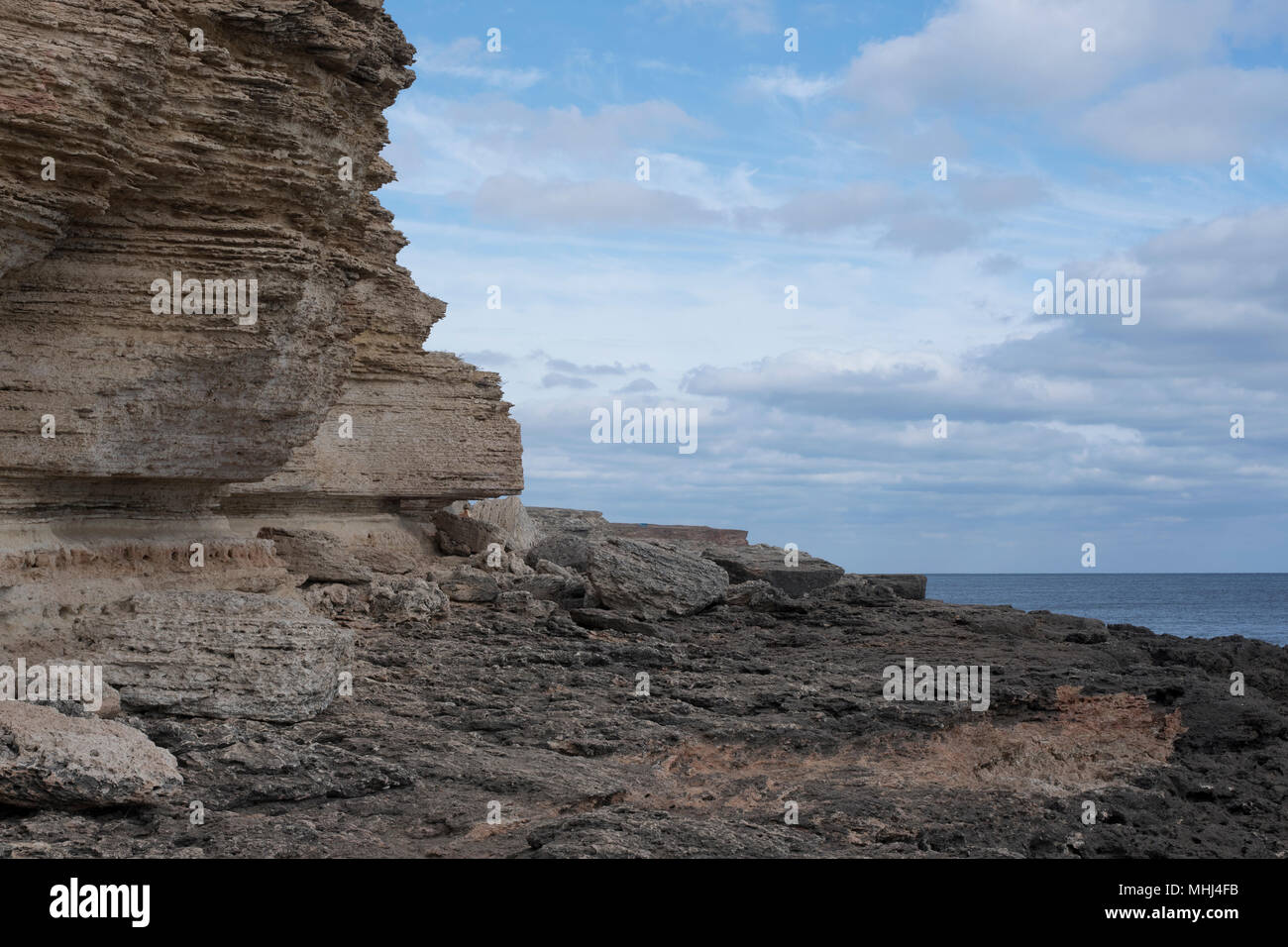 the seashore with rocks and clouds Stock Photo - Alamy