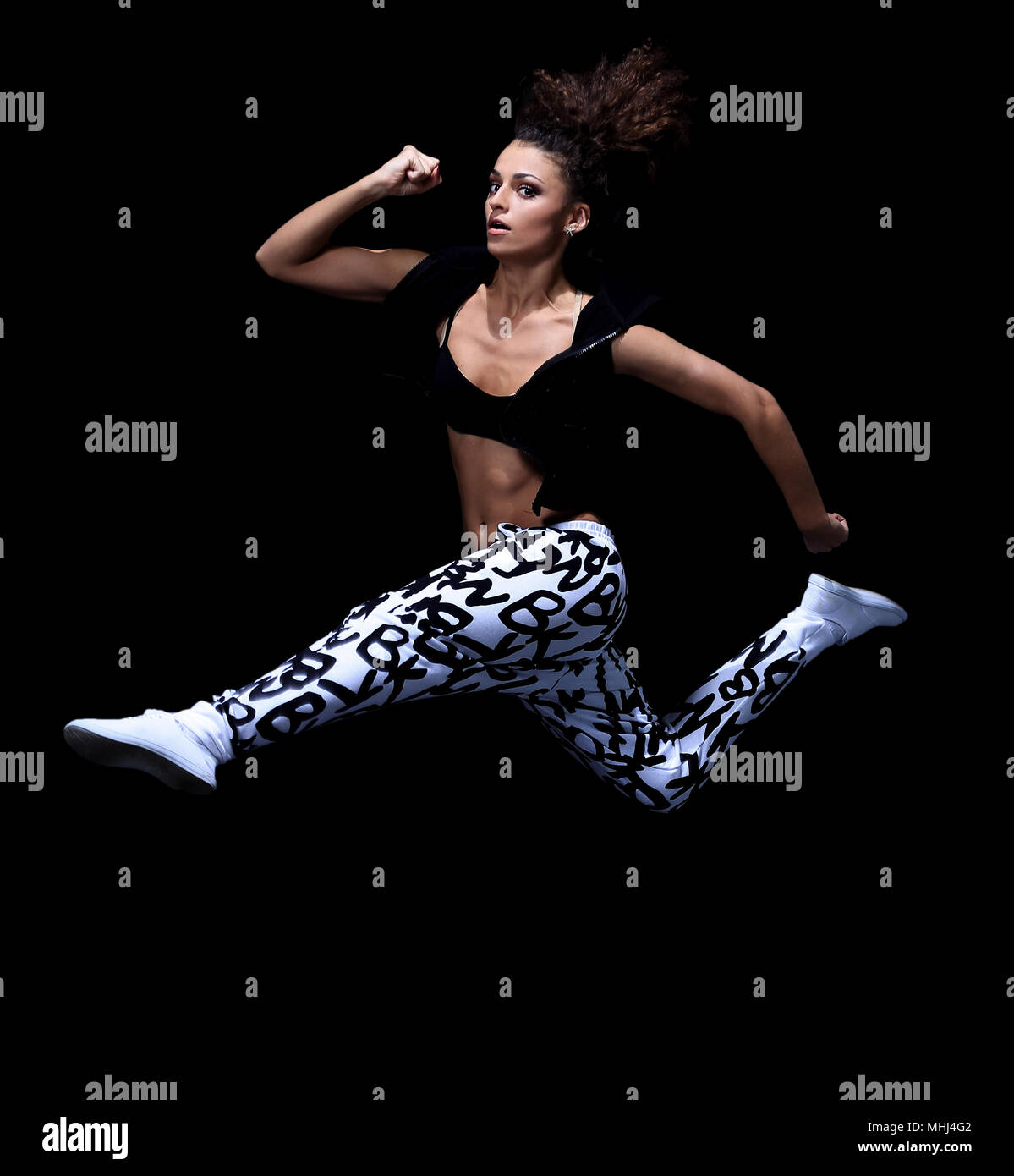 Girl jumping in hip hop style Stock Photo - Alamy