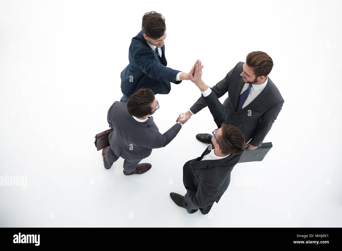 business partners giving a high five Stock Photo - Alamy