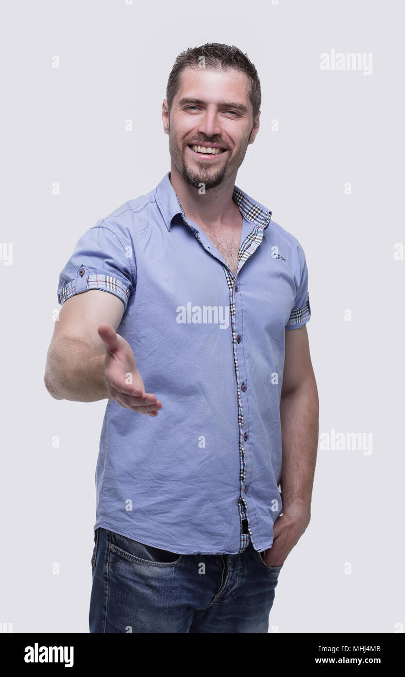 stylish young man holds out his hand for a handshake Stock Photo - Alamy