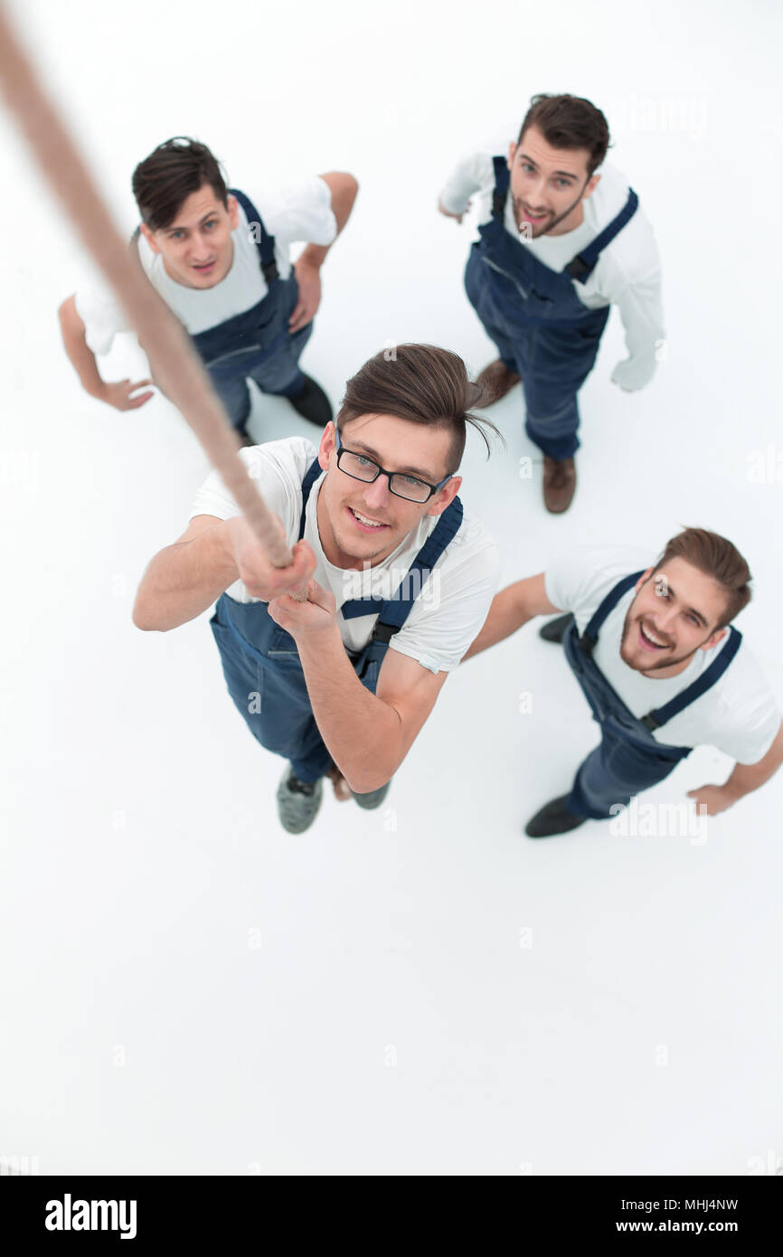 team, helping the leader to climb up the rope Stock Photo - Alamy