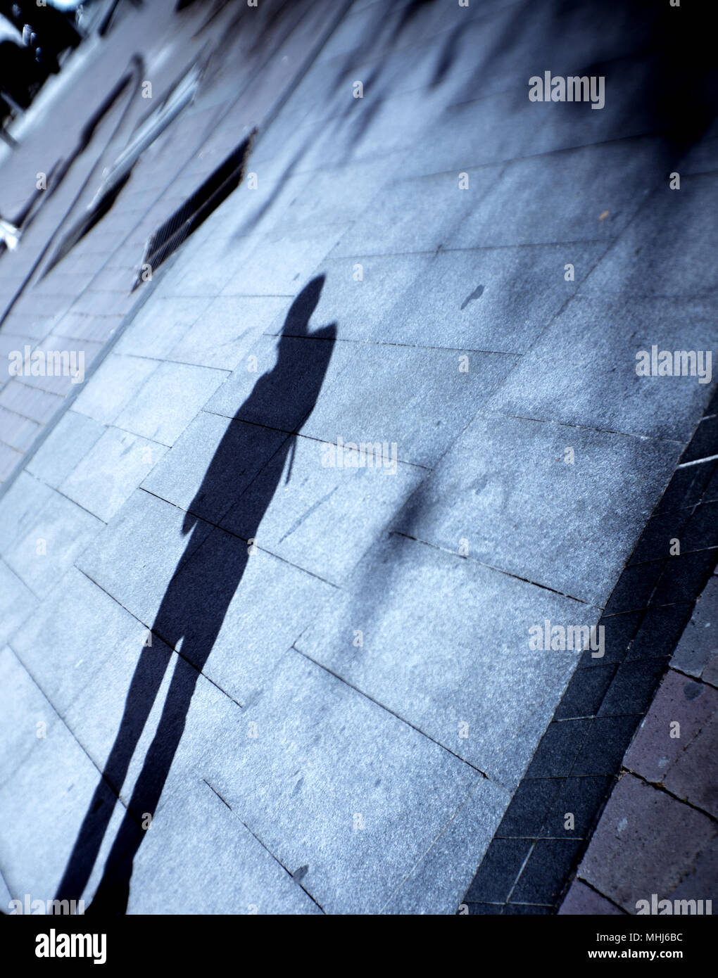 Shadow of young boy on the street floor. Tranquil scene Stock Photo - Alamy